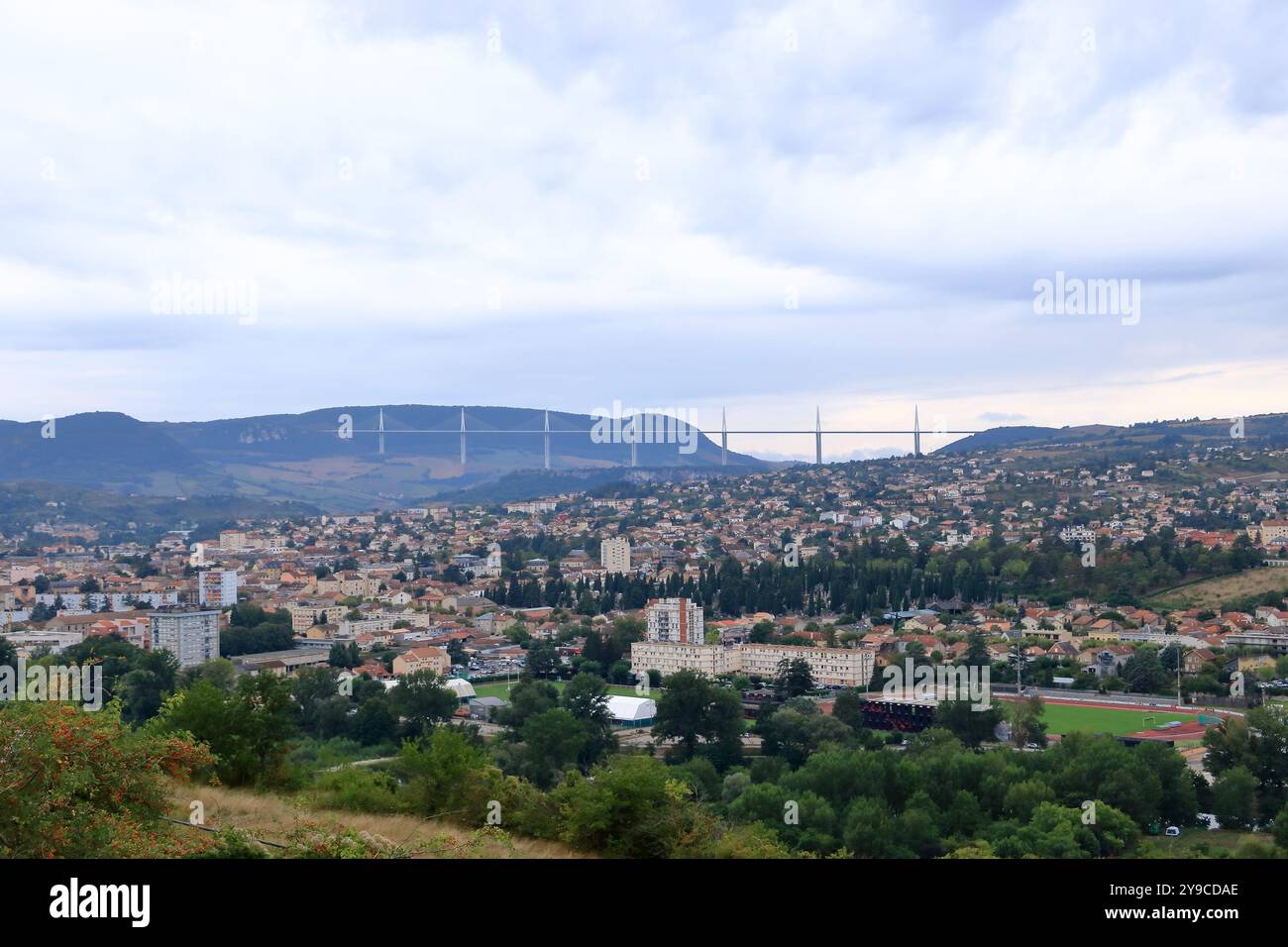 aerial view over the city of Millau with the Viaduct in the background ...