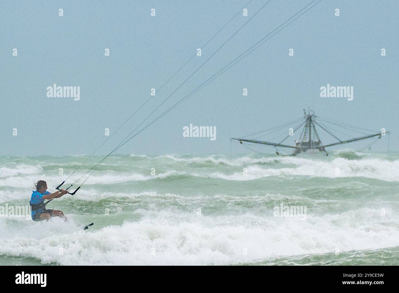 Key West, United States. 09th Oct, 2024. A kite surfer rides the waves ...