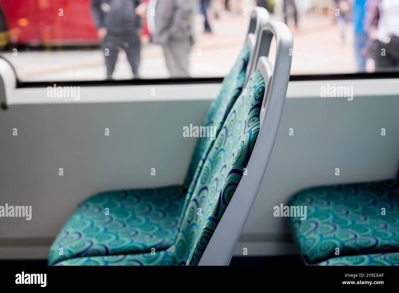 Interior of a city bus without passengers. A bus with seats near window ...