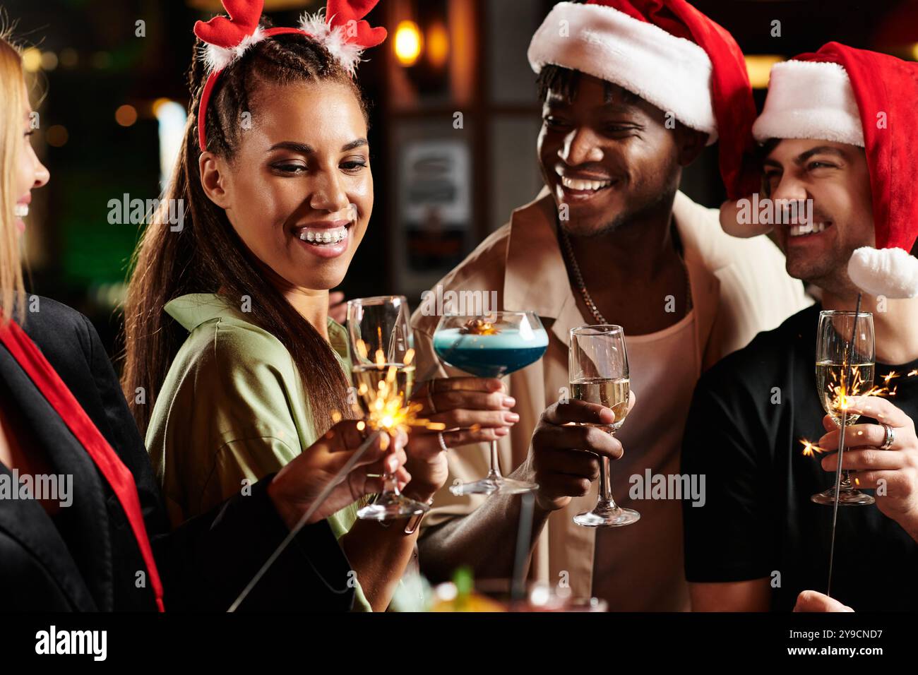 Colleagues of different backgrounds enjoy drinks and laughter at a ...