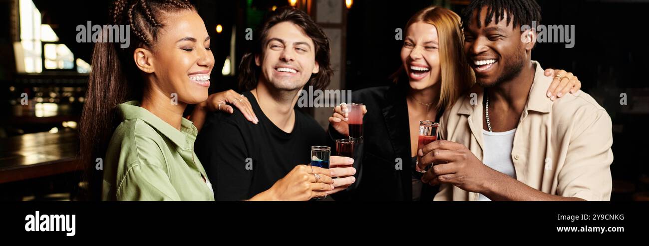 Four colleagues share laughter and drinks, celebrating their ...