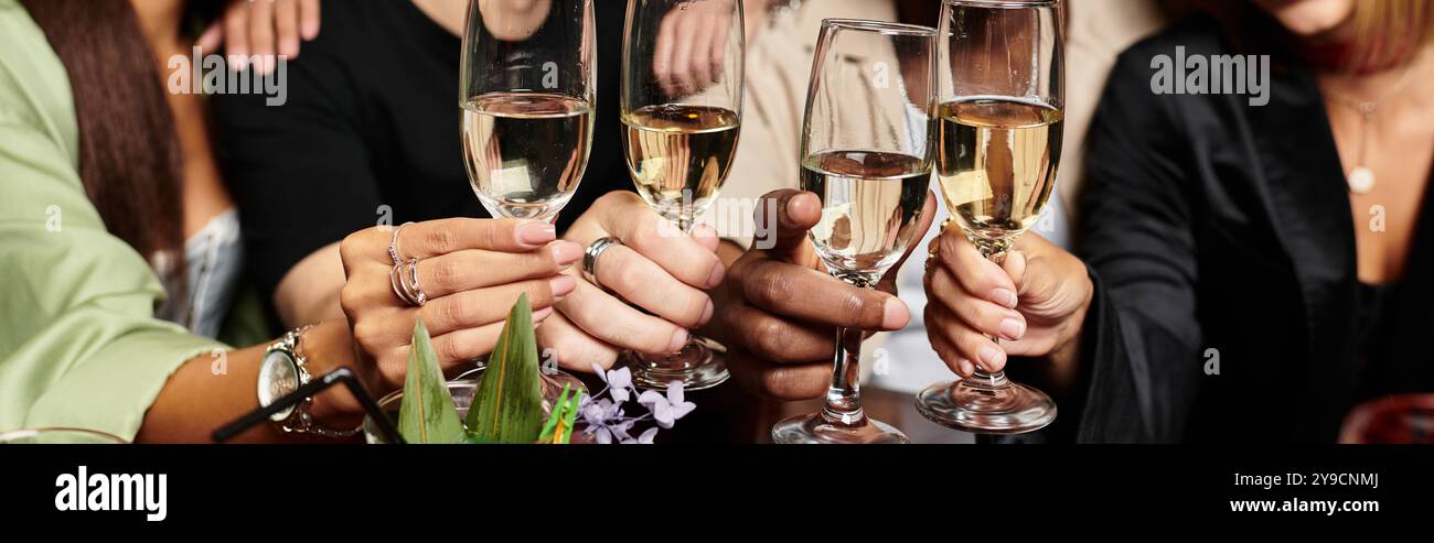 Excited colleagues toast with glasses, celebrating success during a ...