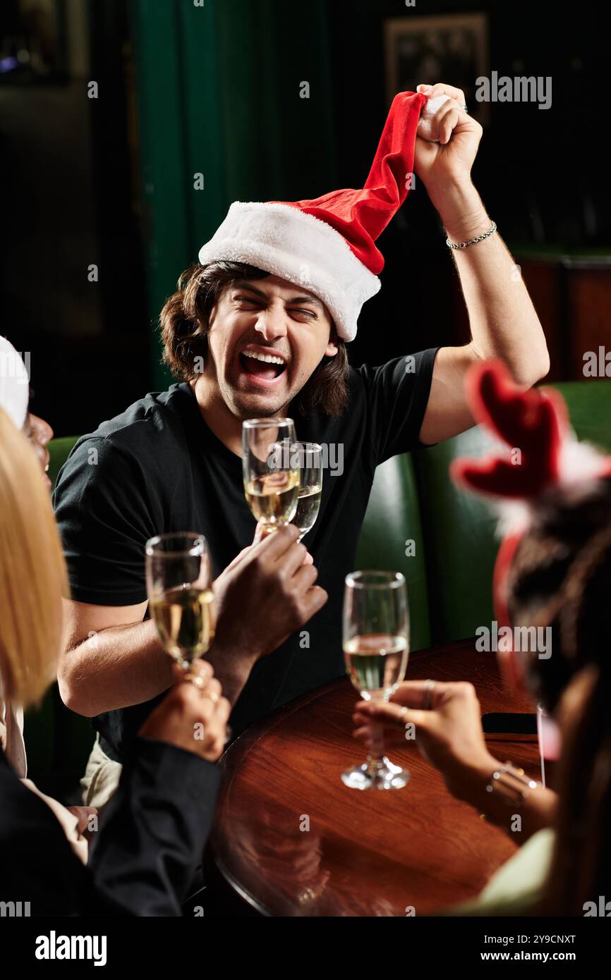 Young colleagues toast together, embodying camaraderie and holiday ...