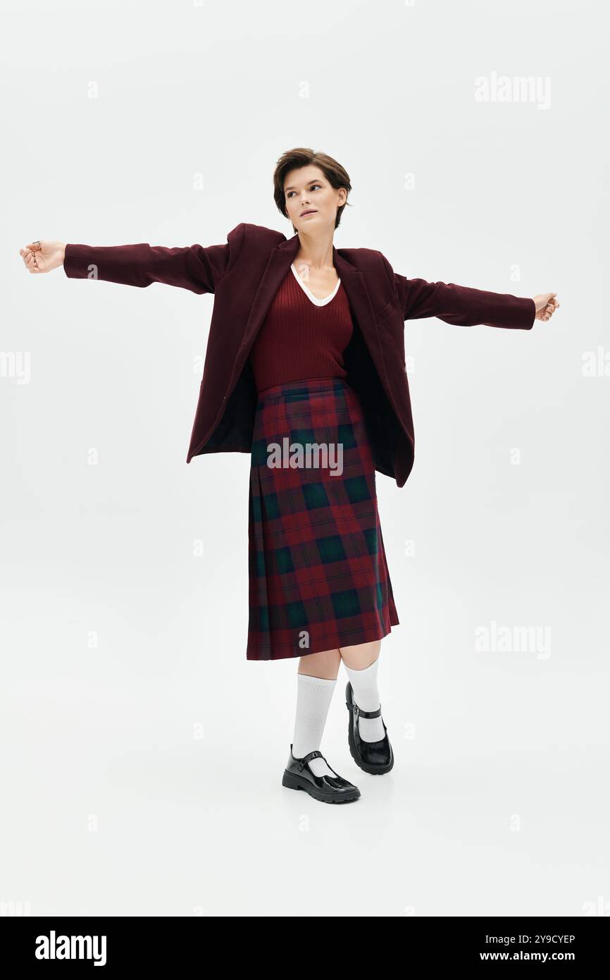 Stylishly dressed woman stands hi-res stock photography and images - Alamy