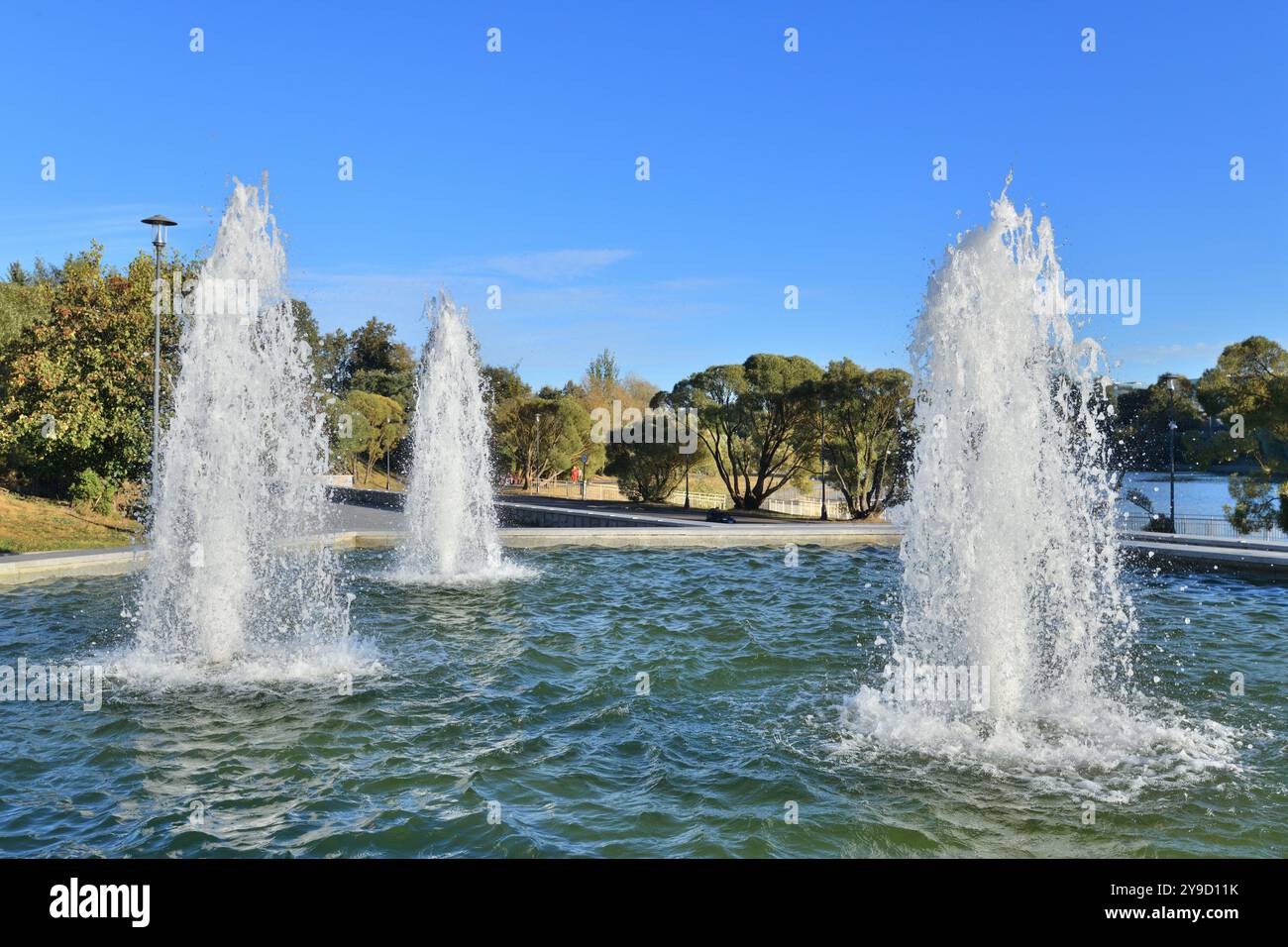 Three jets of a static fountain spurting from the water from the bottom ...