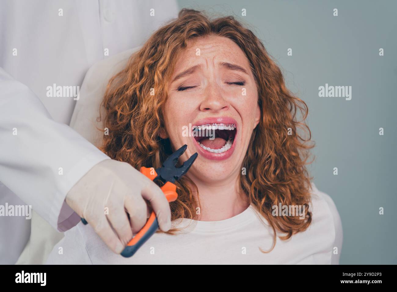 Photo of professional dentist tooth extraction emergency care afraid ...