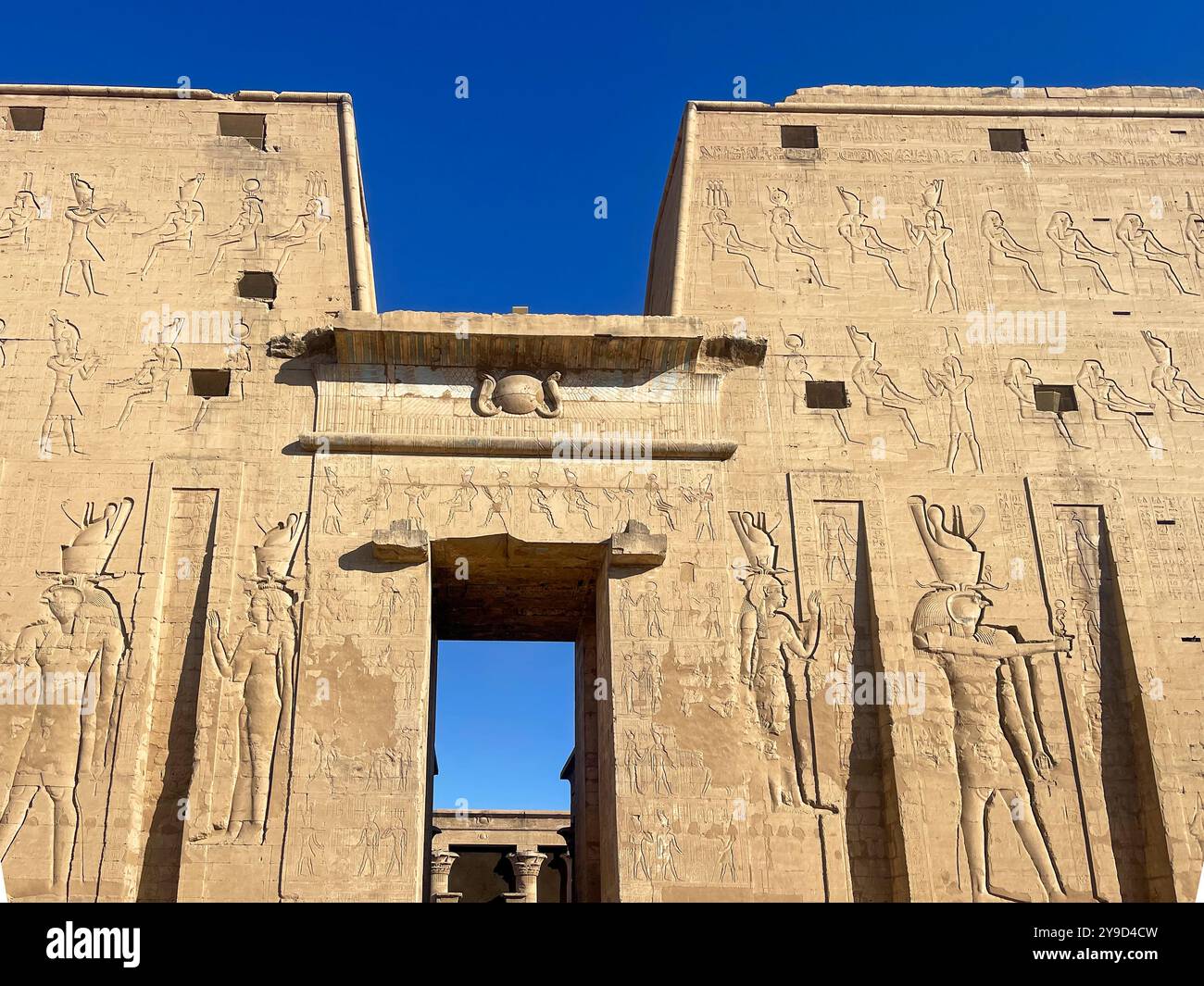 Pass through the sacred gate of the Temple of Horus at Edfu, where ...