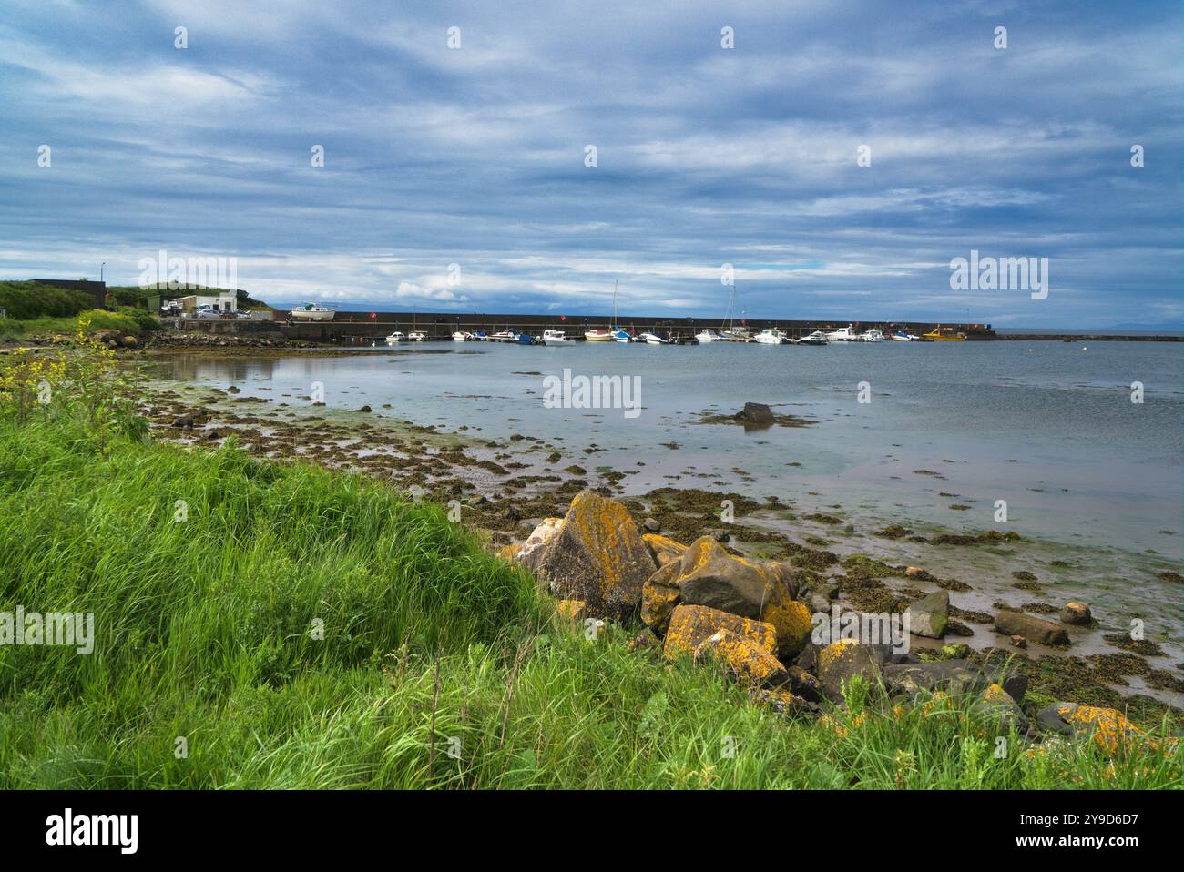 Looking south to Maidens Pier and marina from the seafront at village ...