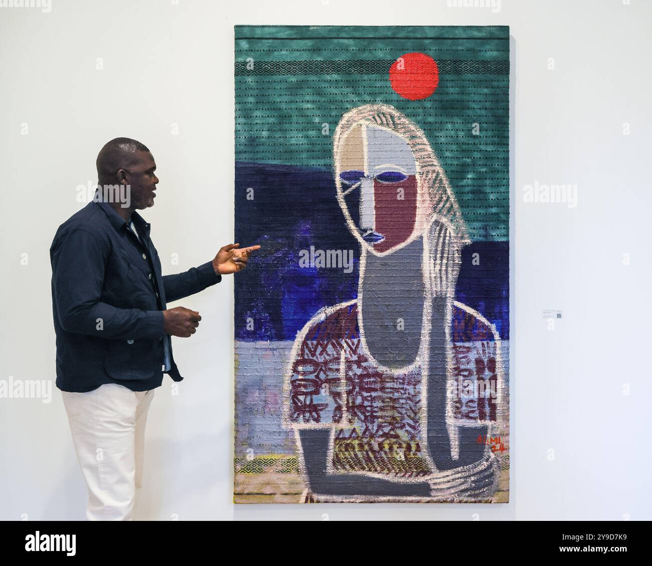 London, UK. 10th Oct, 2024. Artist Alimi Adewale with 'Nature's Embrace ...