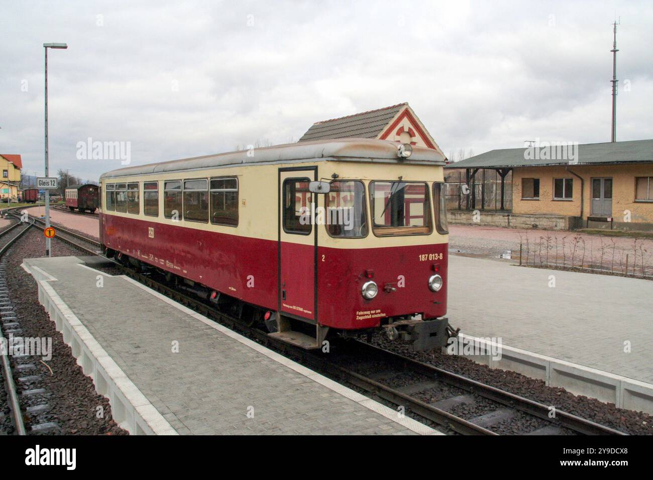 A diesel railcar 187 013-08 leaving Gernrode station on the Harz narrow ...