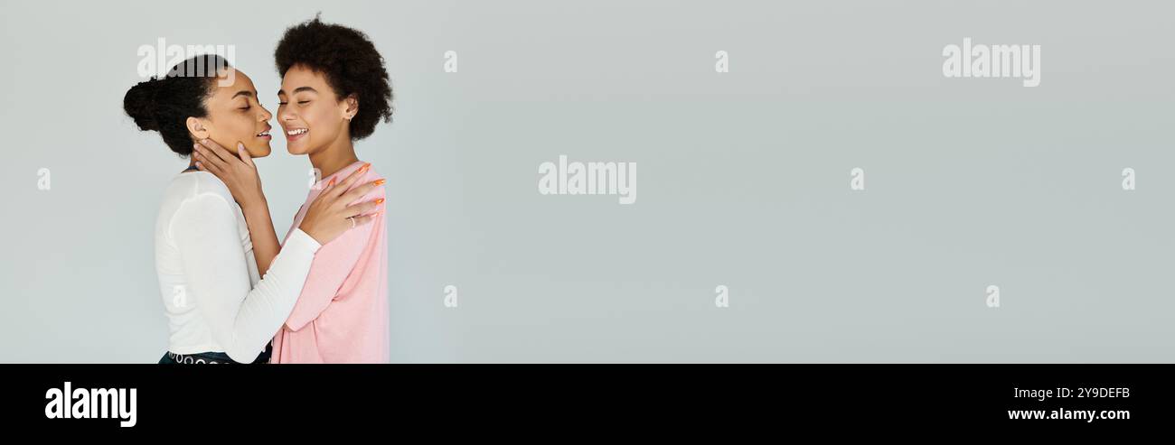 A joyful connection between two women in a minimalistic setting Stock ...