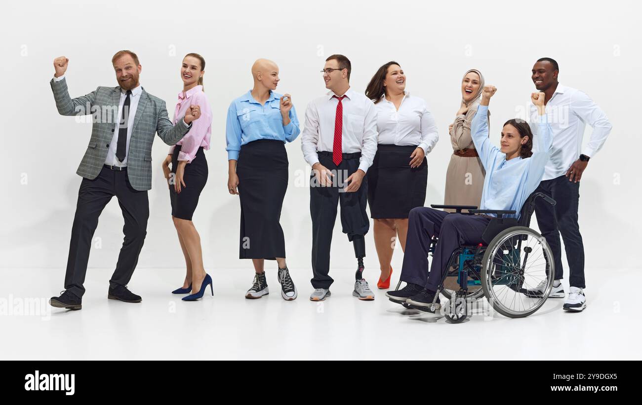 Diverse group of colleagues engage in lively conversation, smiling and ...