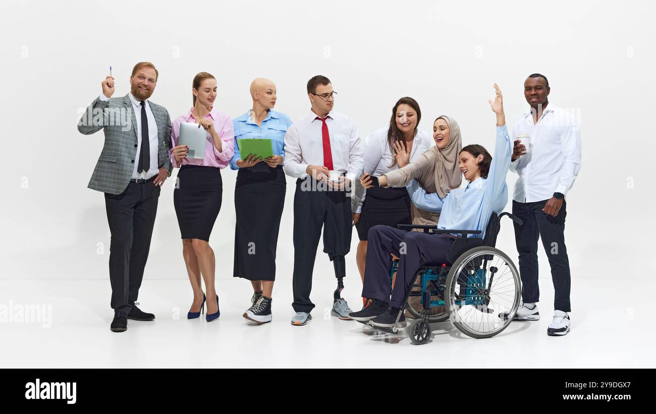 Diverse group of colleagues engage in lively conversation, smiling and ...