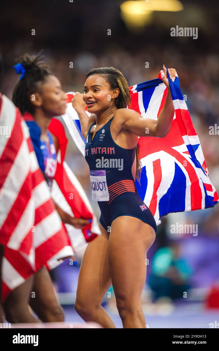 Imani-Lara Lansiquot celebrating with her country's flag in the 4X100 ...