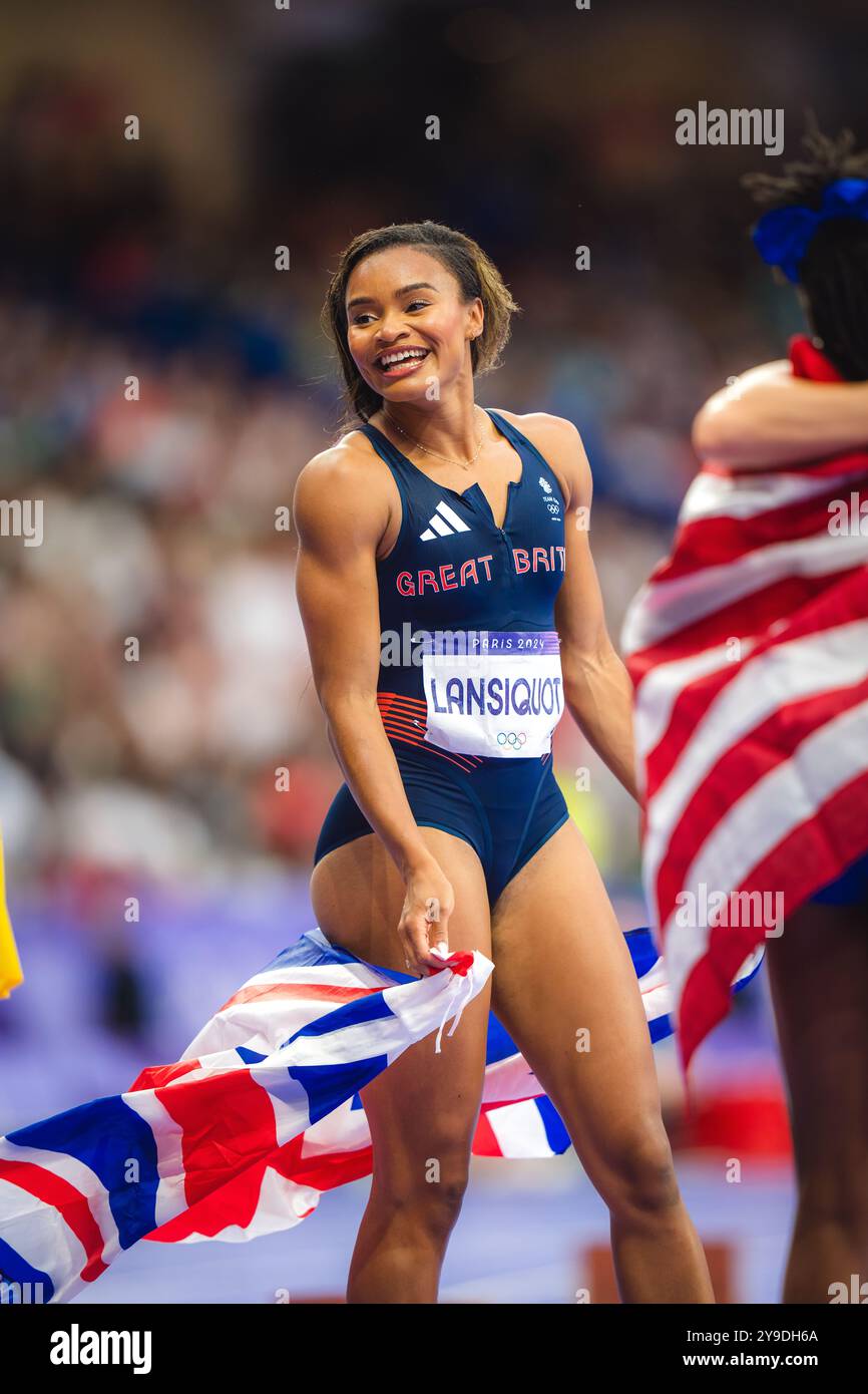 Imani-Lara Lansiquot celebrating with her country's flag in the 4X100 ...