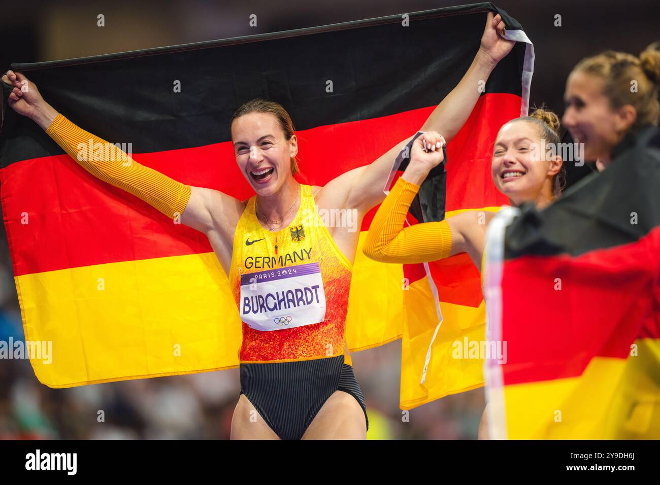 Alexandra Burghardt celebrating with her country's flag in the 4X100 ...