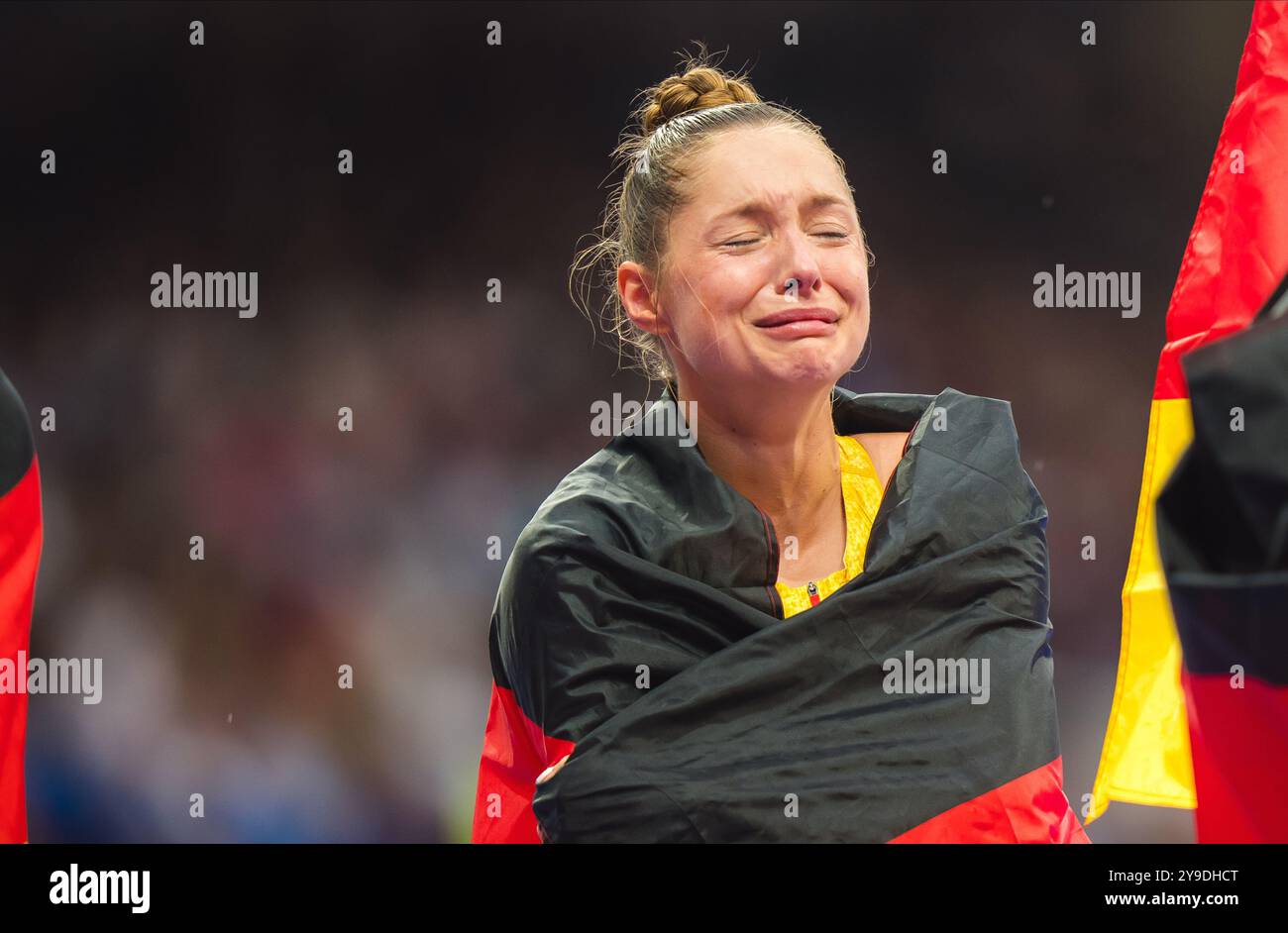 Gina Lückenkemper celebrating with her country's flag in the 4X100 ...