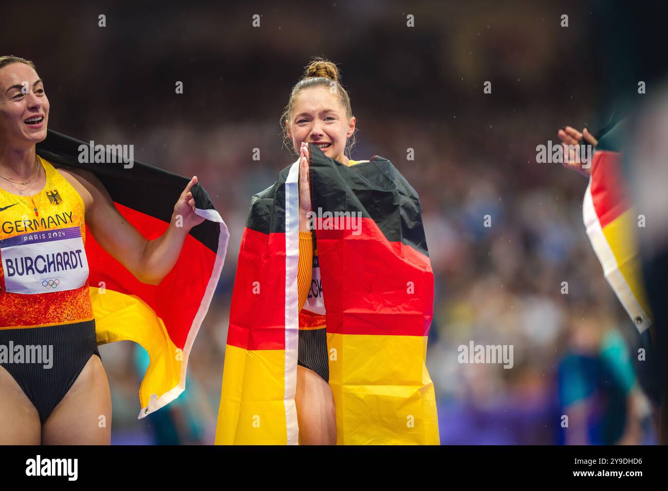 Gina Lückenkemper celebrating with her country's flag in the 4X100 ...