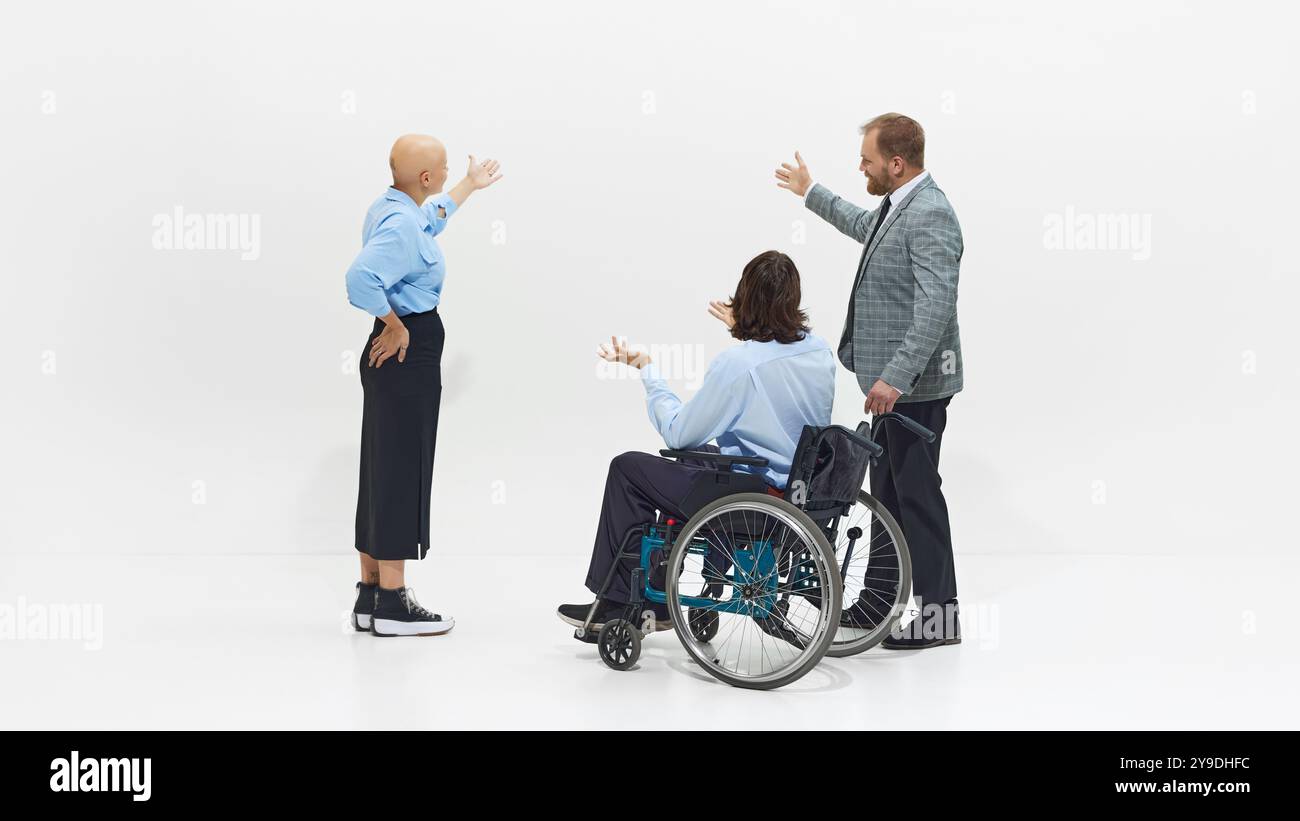 Three colleagues animatedly discussing ideas, gesturing, active ...