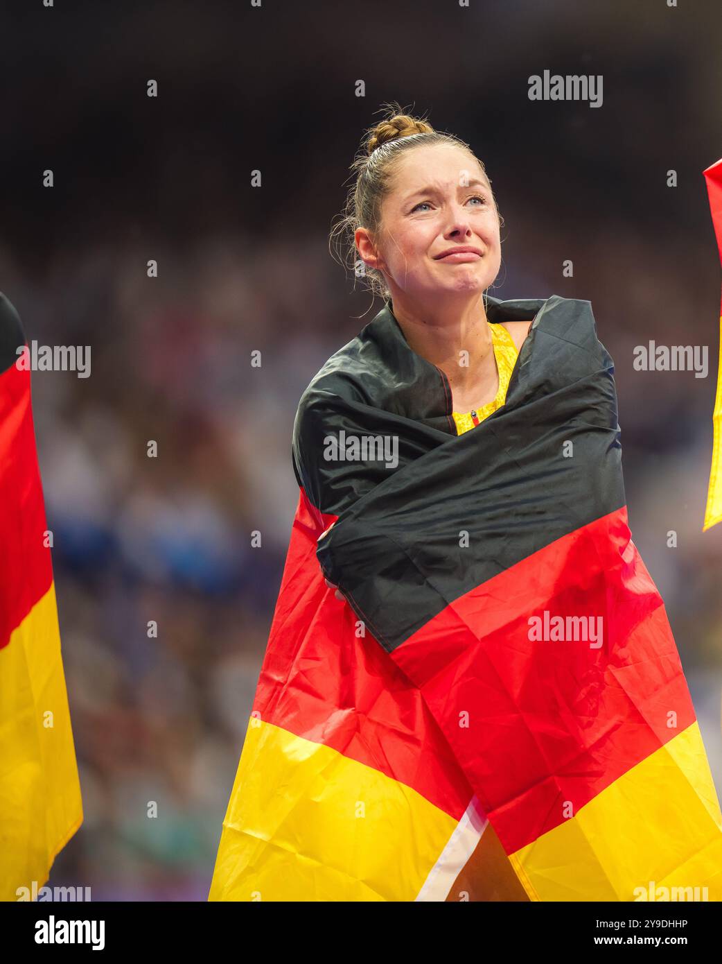 Gina Lückenkemper celebrating with her country's flag in the 4X100 ...