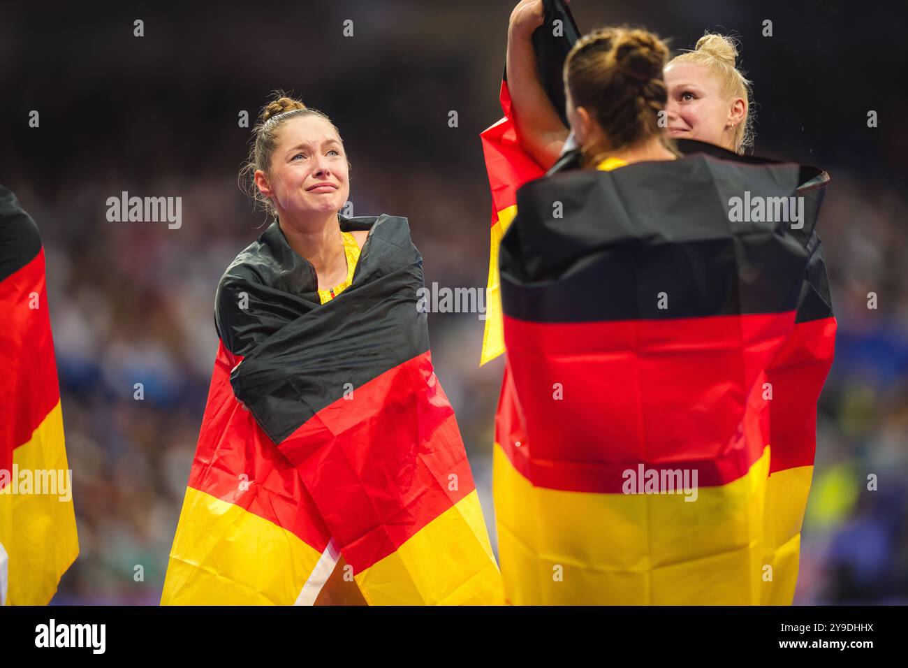 Gina Lückenkemper celebrating with her country's flag in the 4X100 ...