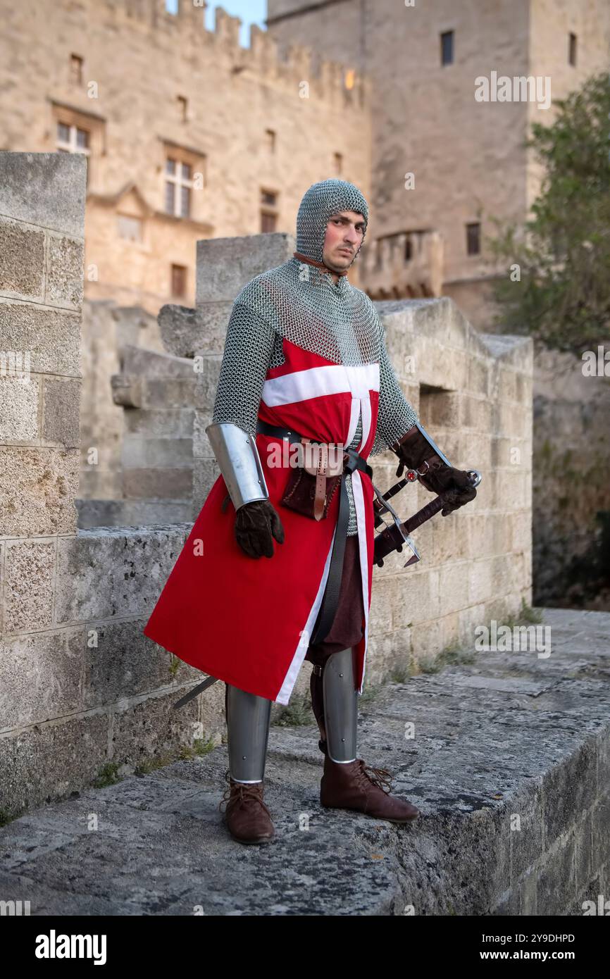 A meember of the Rhodes Medieval Rose Association Knights' Swords Team ...