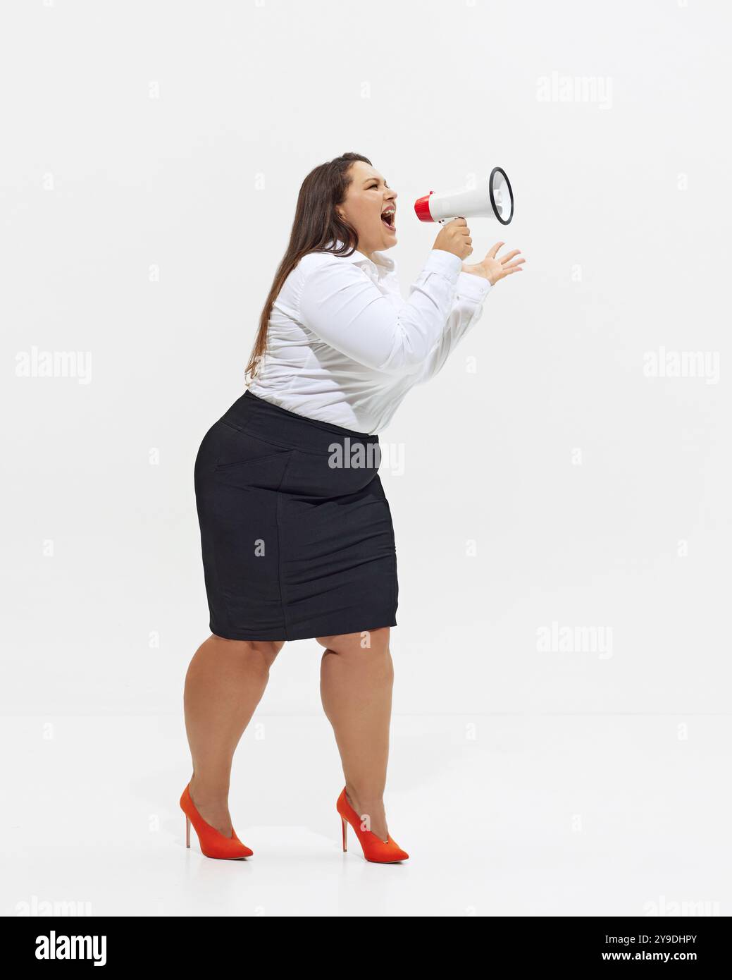 Woman megaphone passionately speaking in hi-res stock photography and ...