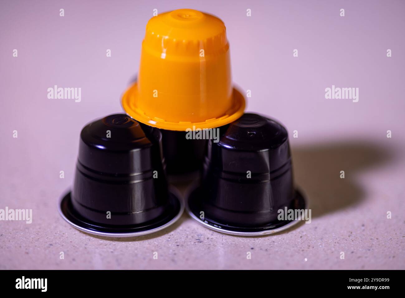 A detailed shot of assorted coffee capsules, displaying different ...