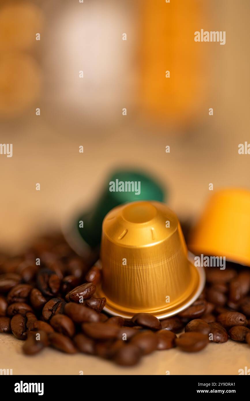 showcasing colorful coffee capsules sitting on a bed of roasted beans ...