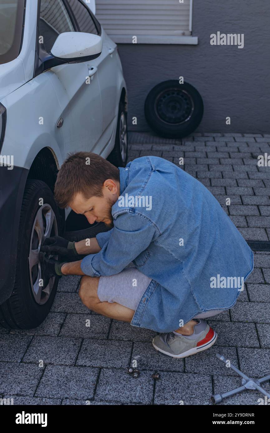 Young man in unscrewing hi-res stock photography and images - Alamy