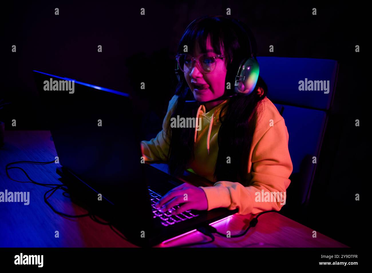 Photo of cute lovely girl curious stick tongue out excited play gamer ...