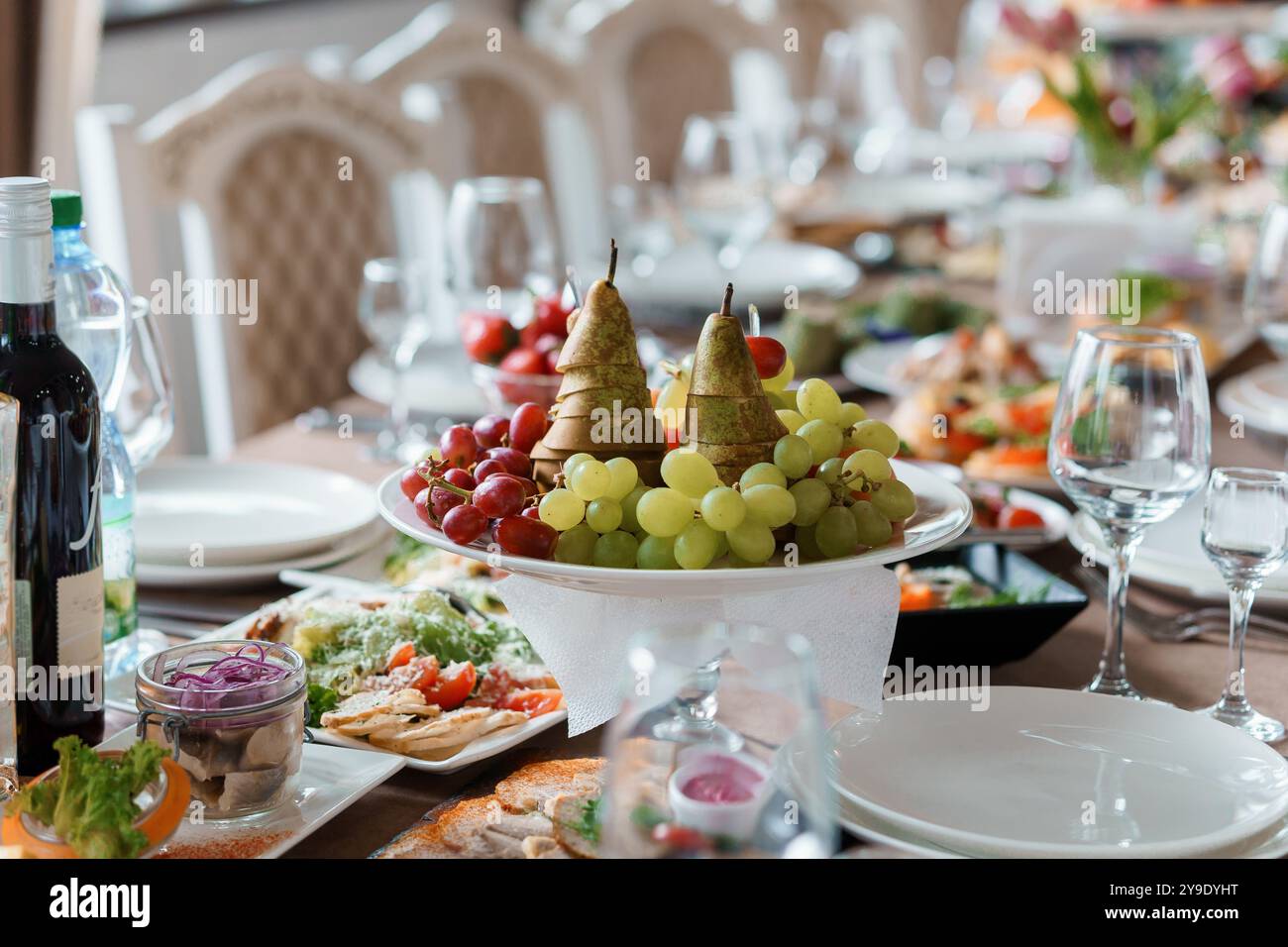 Elegant Banquet Table Setting with Glorious Fresh Fruits and Culinary Delights Stock Photo - Alamy