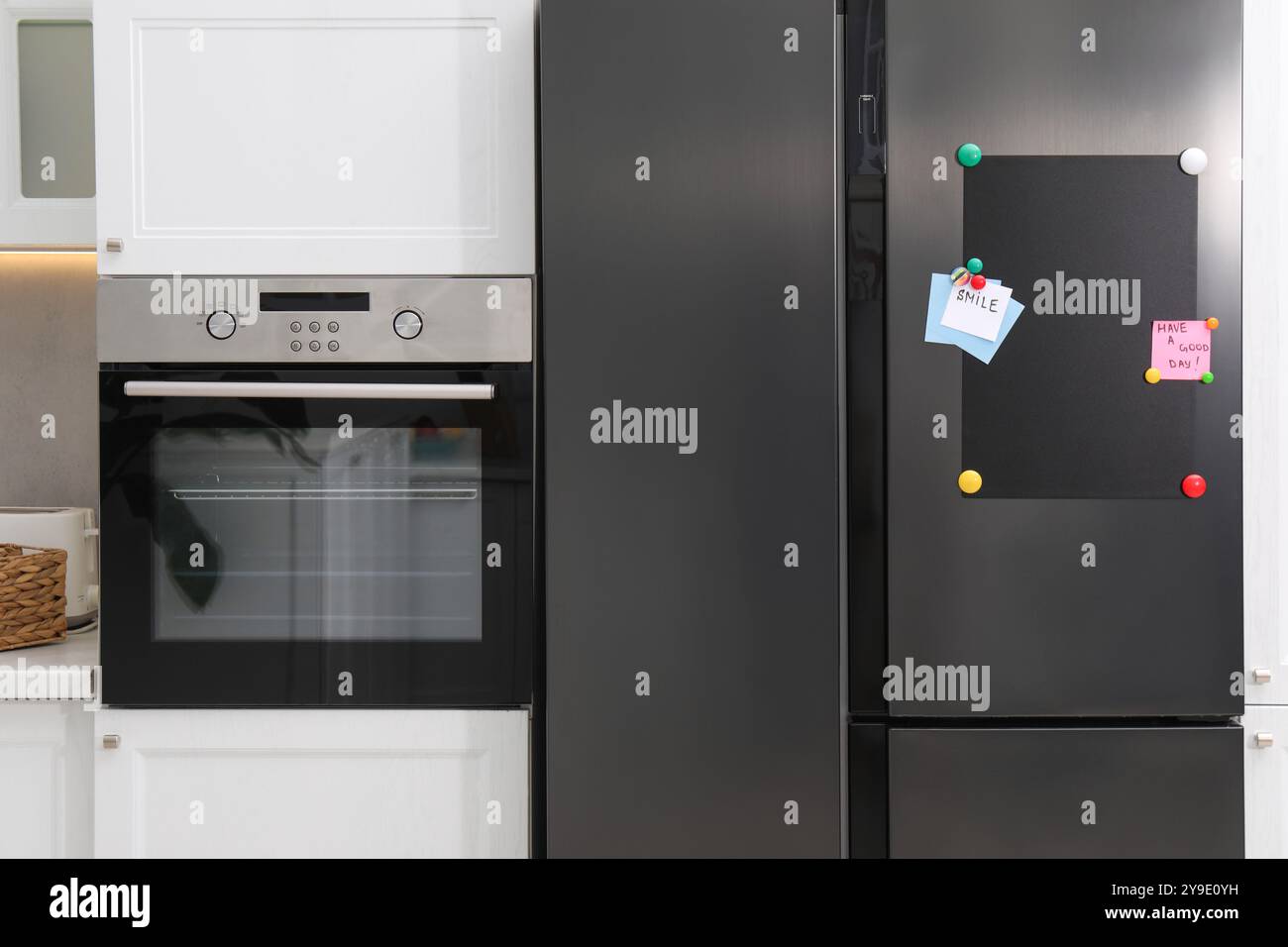 Magnetic board and notes on refrigerator in kitchen Stock Photo - Alamy