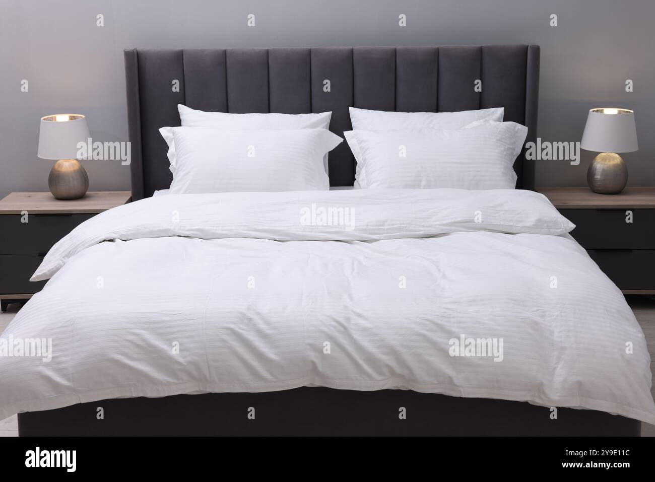 Bed with clean linens and pillows indoors Stock Photo - Alamy
