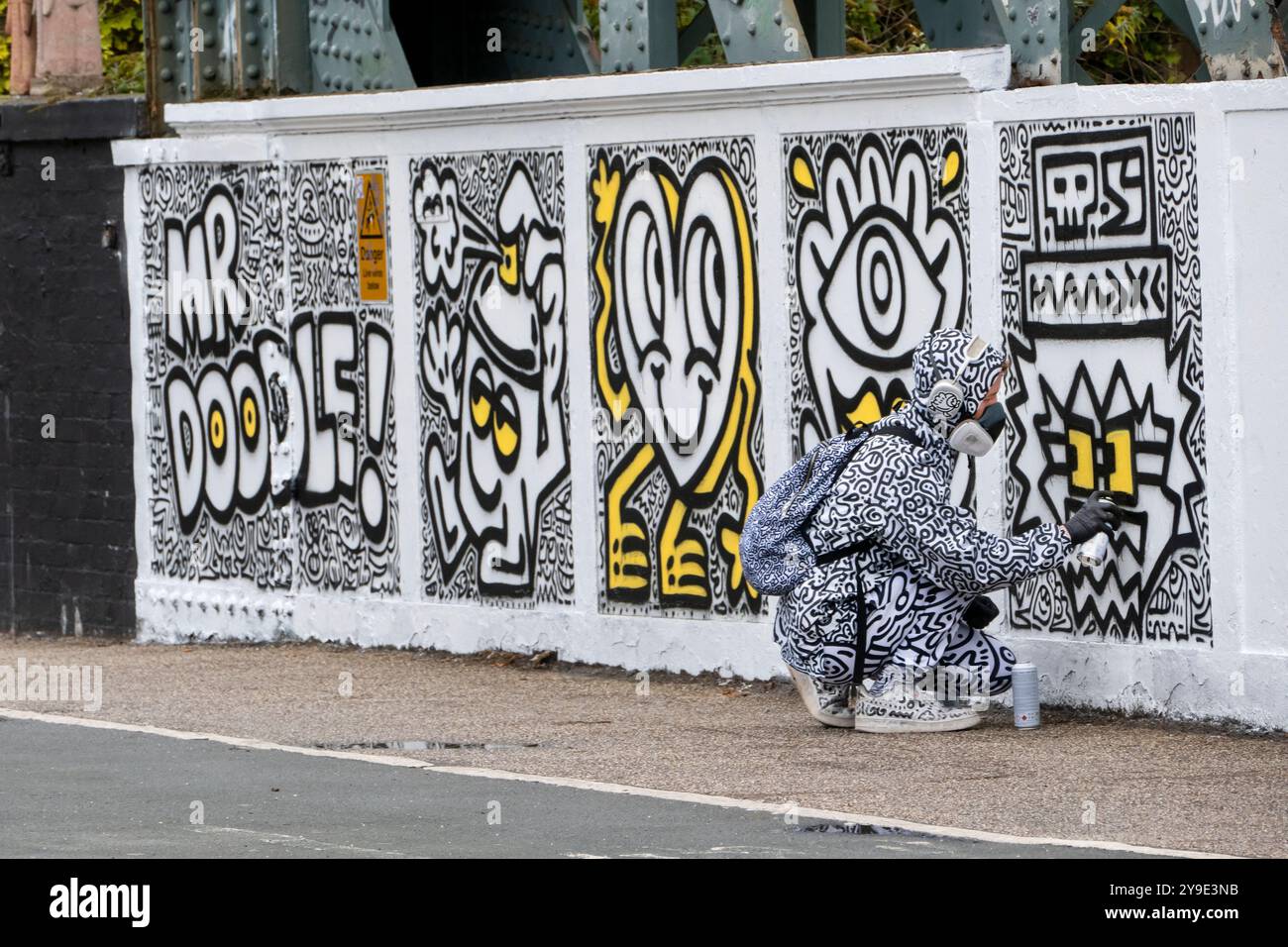 Street artist Mr Doodle working on a new mural 'Have A Doodley Day' on ...