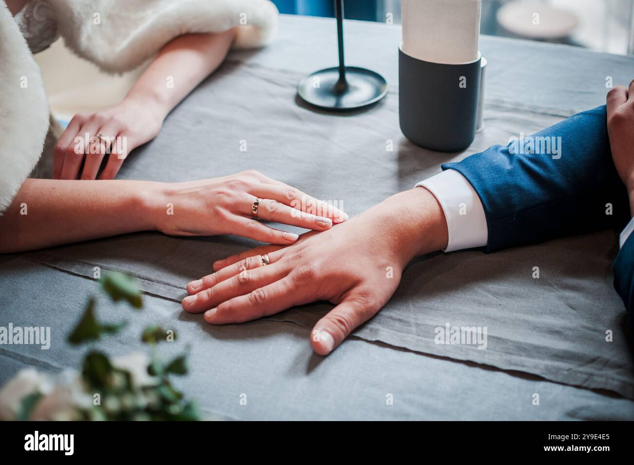 Intimate Connection: A Tender Moment Between Two Hands at a Celebration ...