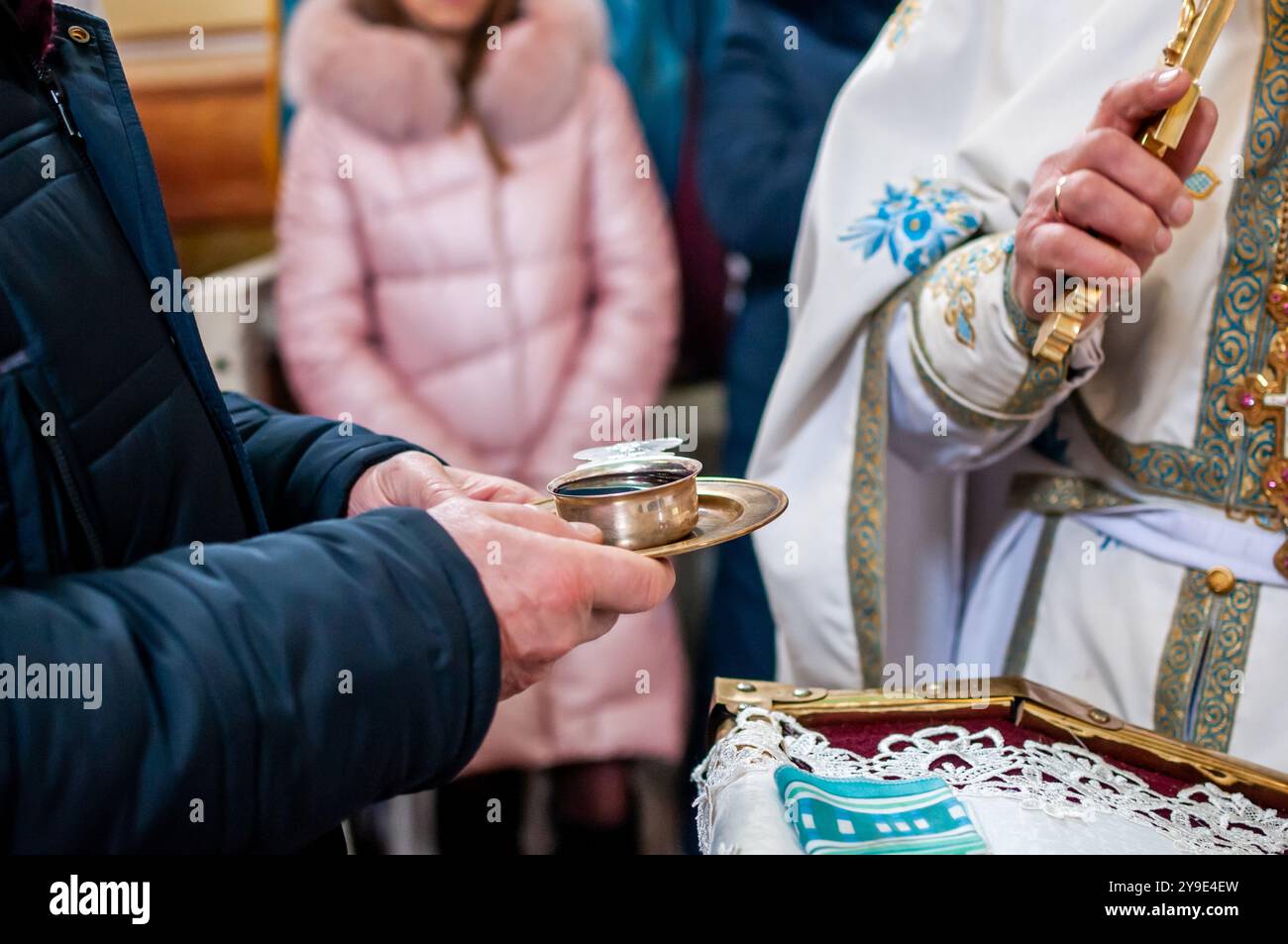 Sacred Ceremony: A Moment of Blessing with Silver Vessels in a ...