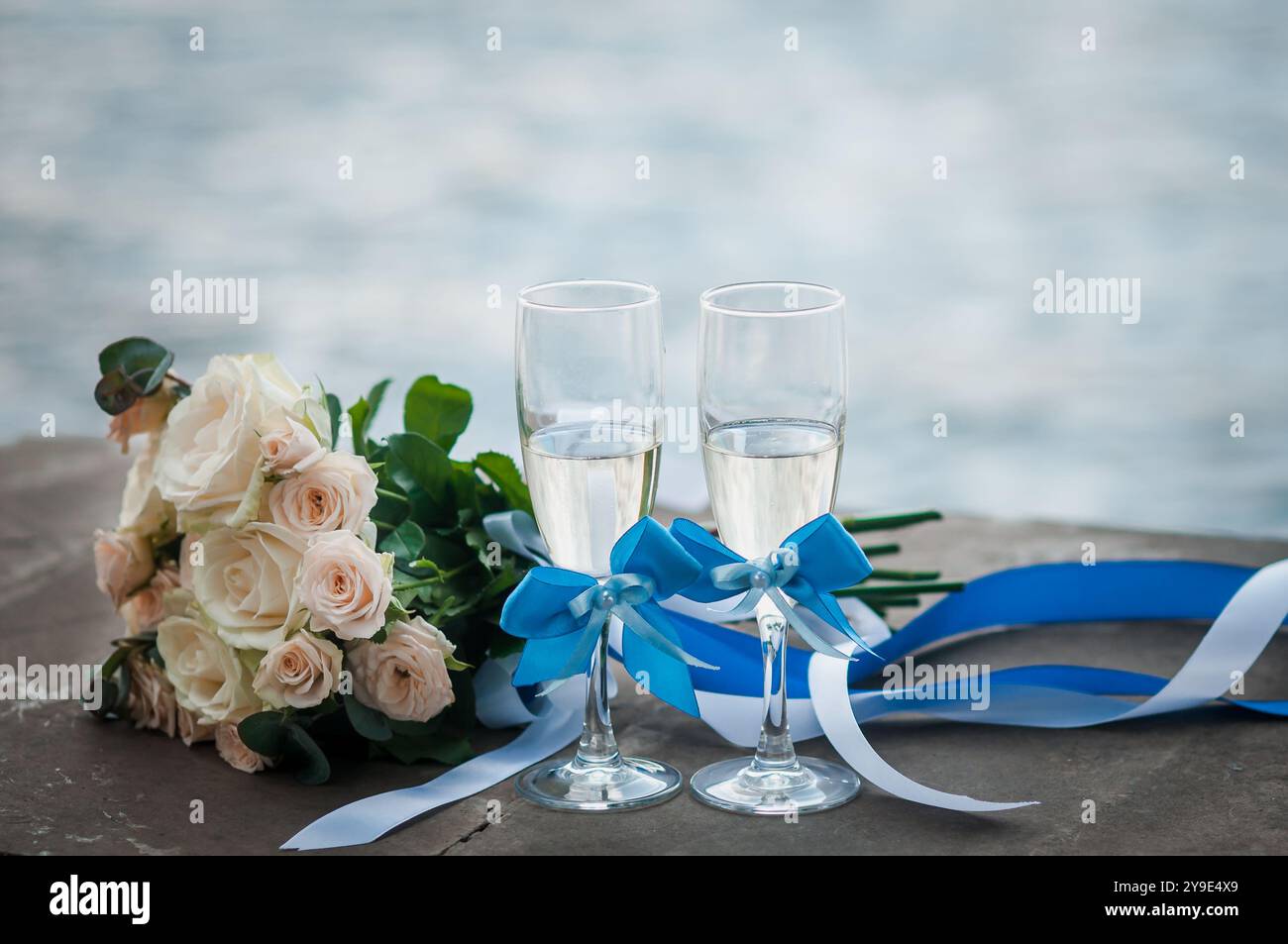 Romantic Wedding Toast with Elegant Floral Arrangement by the Water ...