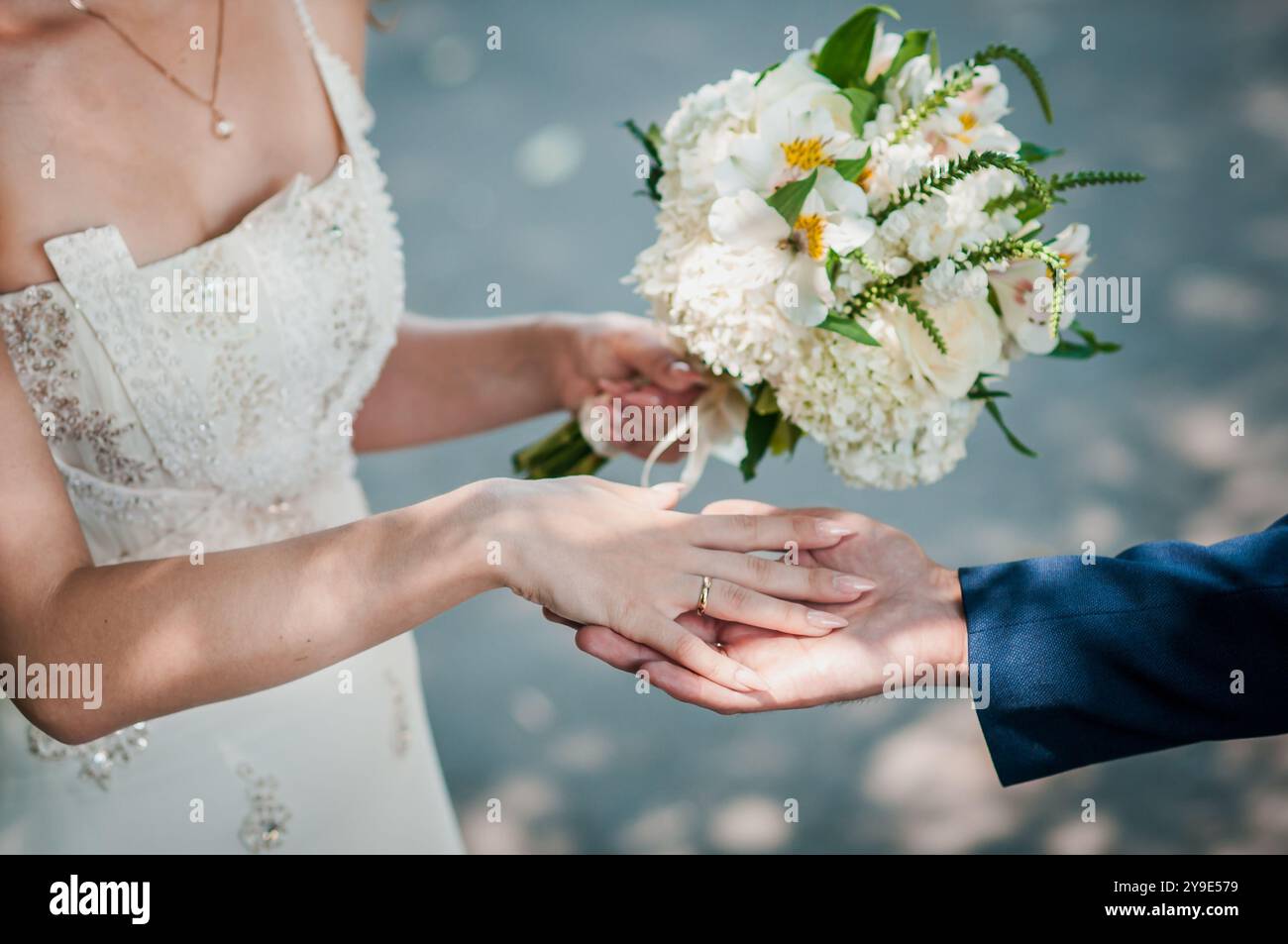 Romantic Wedding Moment with Bride and Groom Holding Hands Stock Photo ...