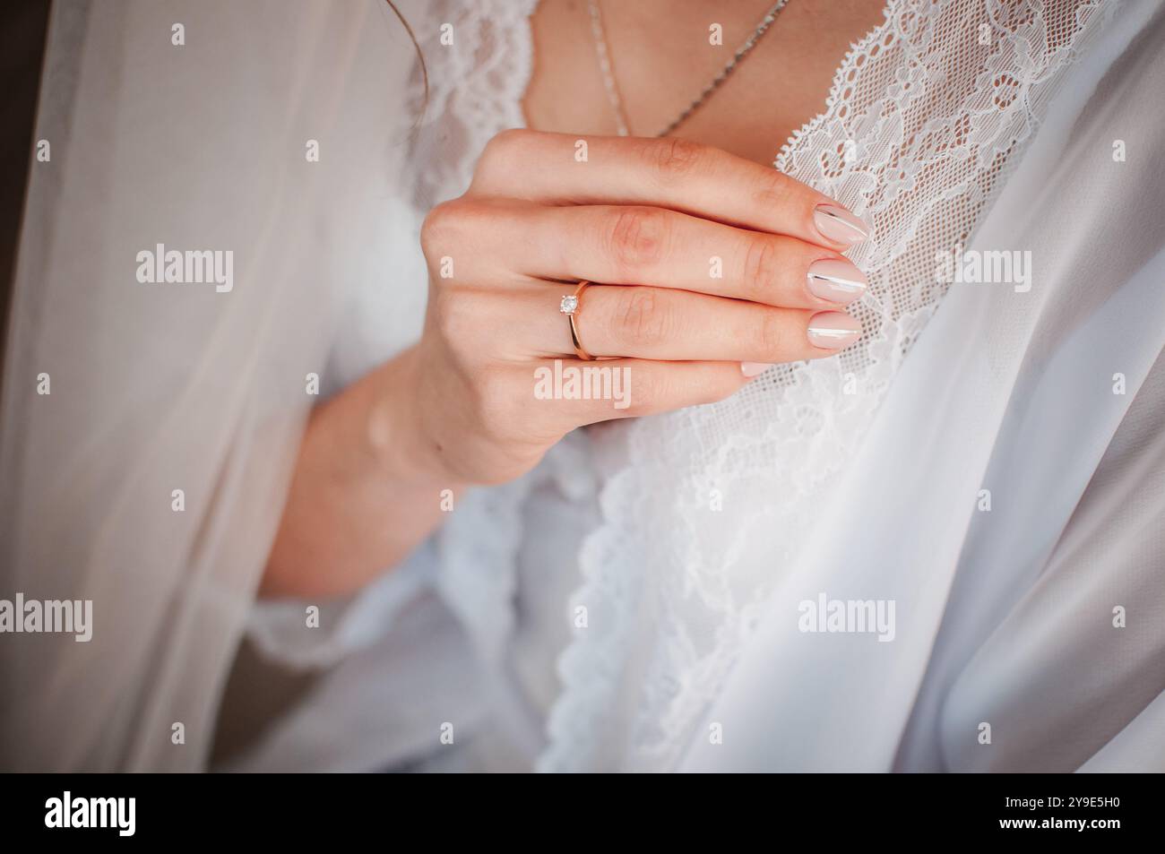 Delicate Bride Adorned in Elegance with a Sparkling Ring and Lace ...