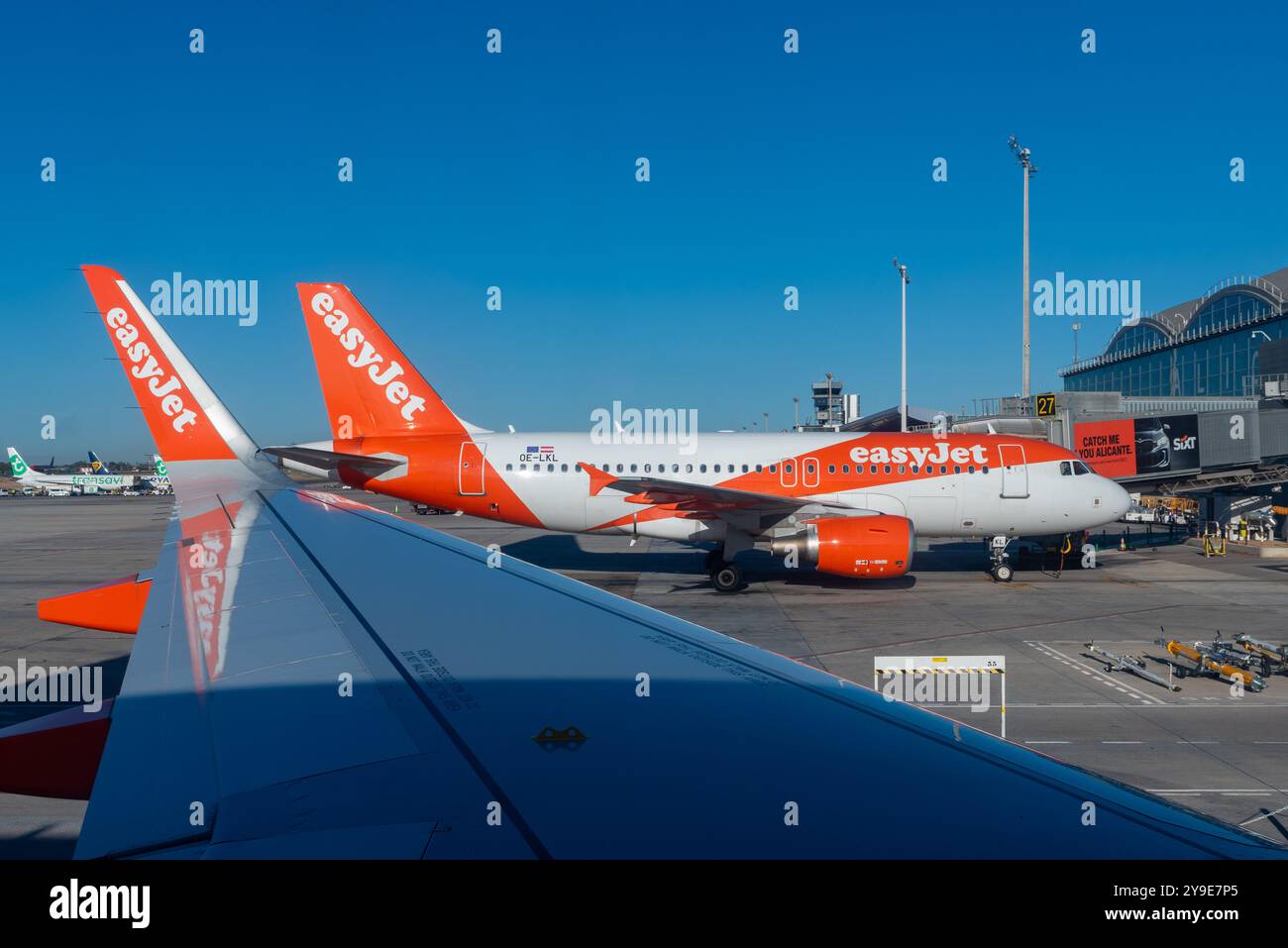 easyJet airliner jet planes at Alicante Elche Miguel Hernández Airport terminal, Spain, Europe ...
