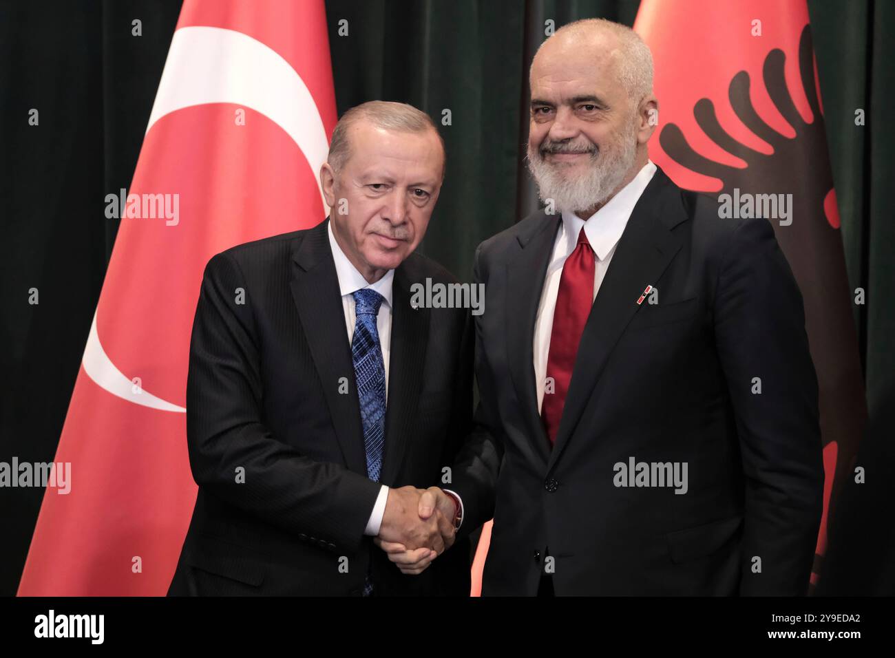 Prime Minister of Albania Edi Rama, right, shakes hands with Turkey's ...