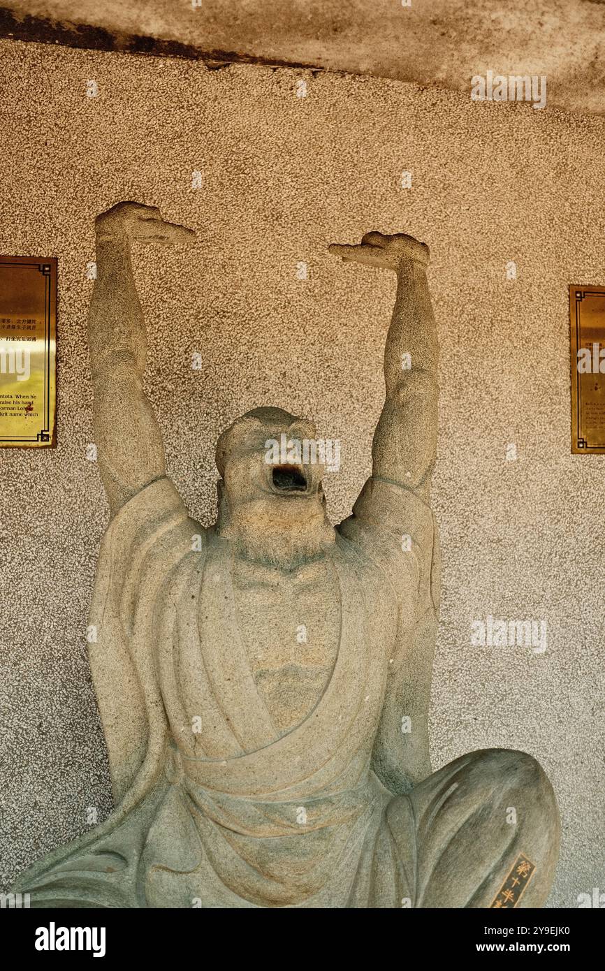 Raised Hand Lohan sculpture in buddhist Chin Swee Caves Temple in ...