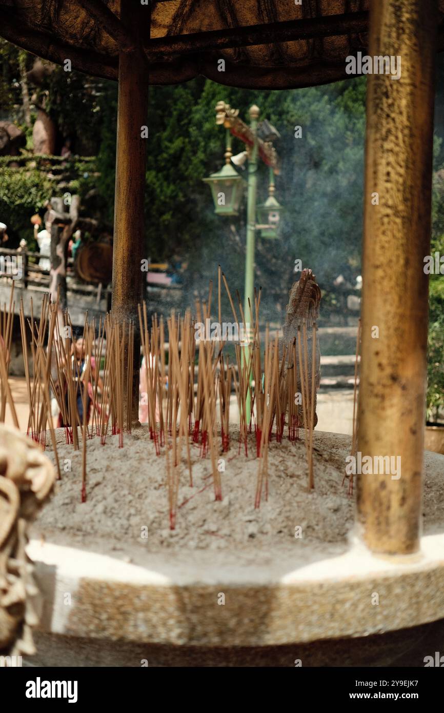 Burning and smoking incense sticks in buddhist Chin Swee Caves Temple ...