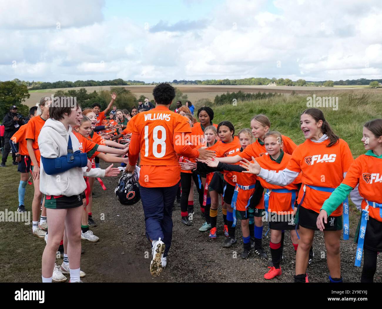 Chicago Bears quarterback Caleb Williams (18) walks through an honor ...