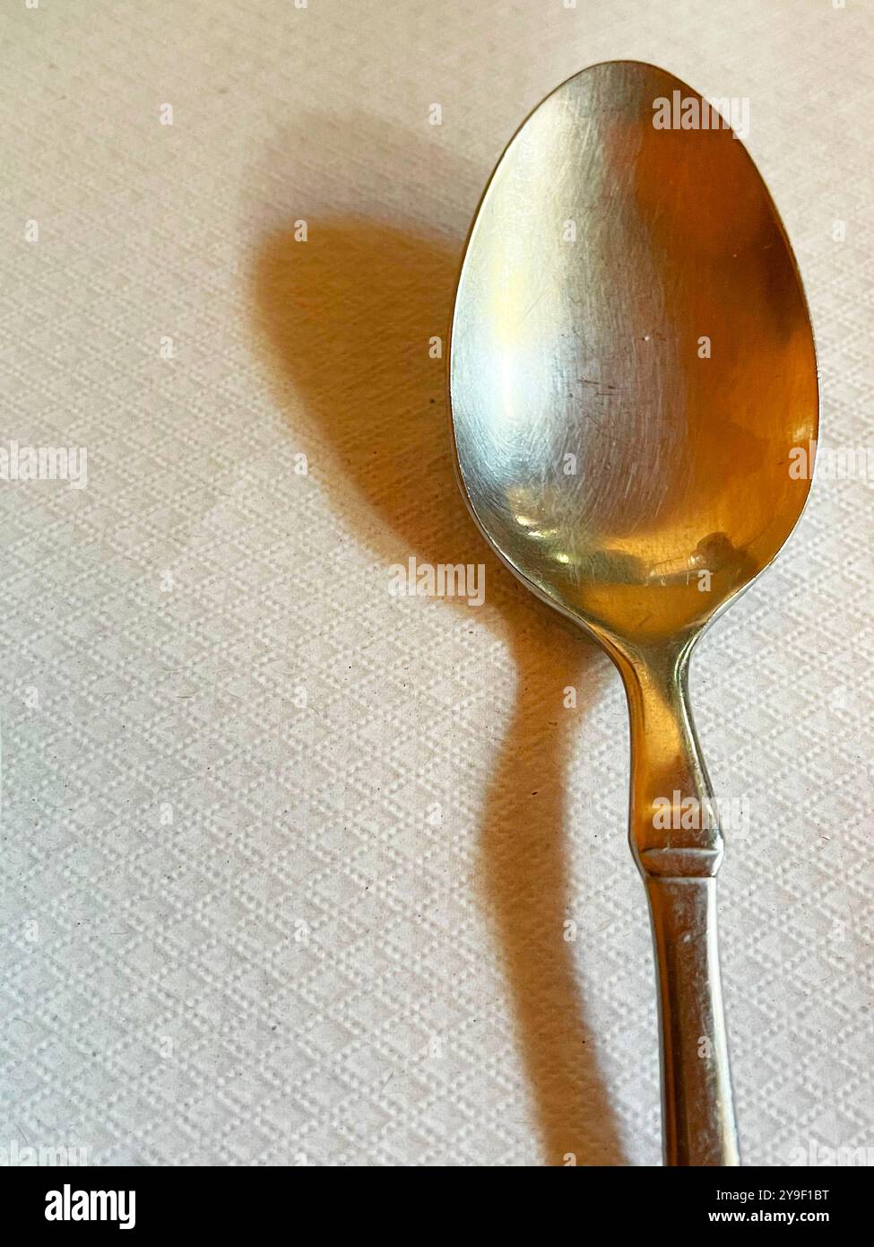 Spoon and its shadow Stock Photo - Alamy