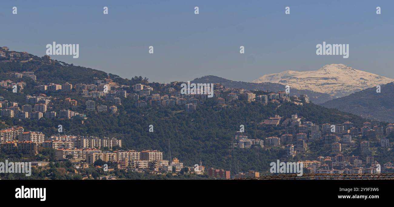 The scenic panorama of Beirut suburb hills, with snowy mountains in the ...