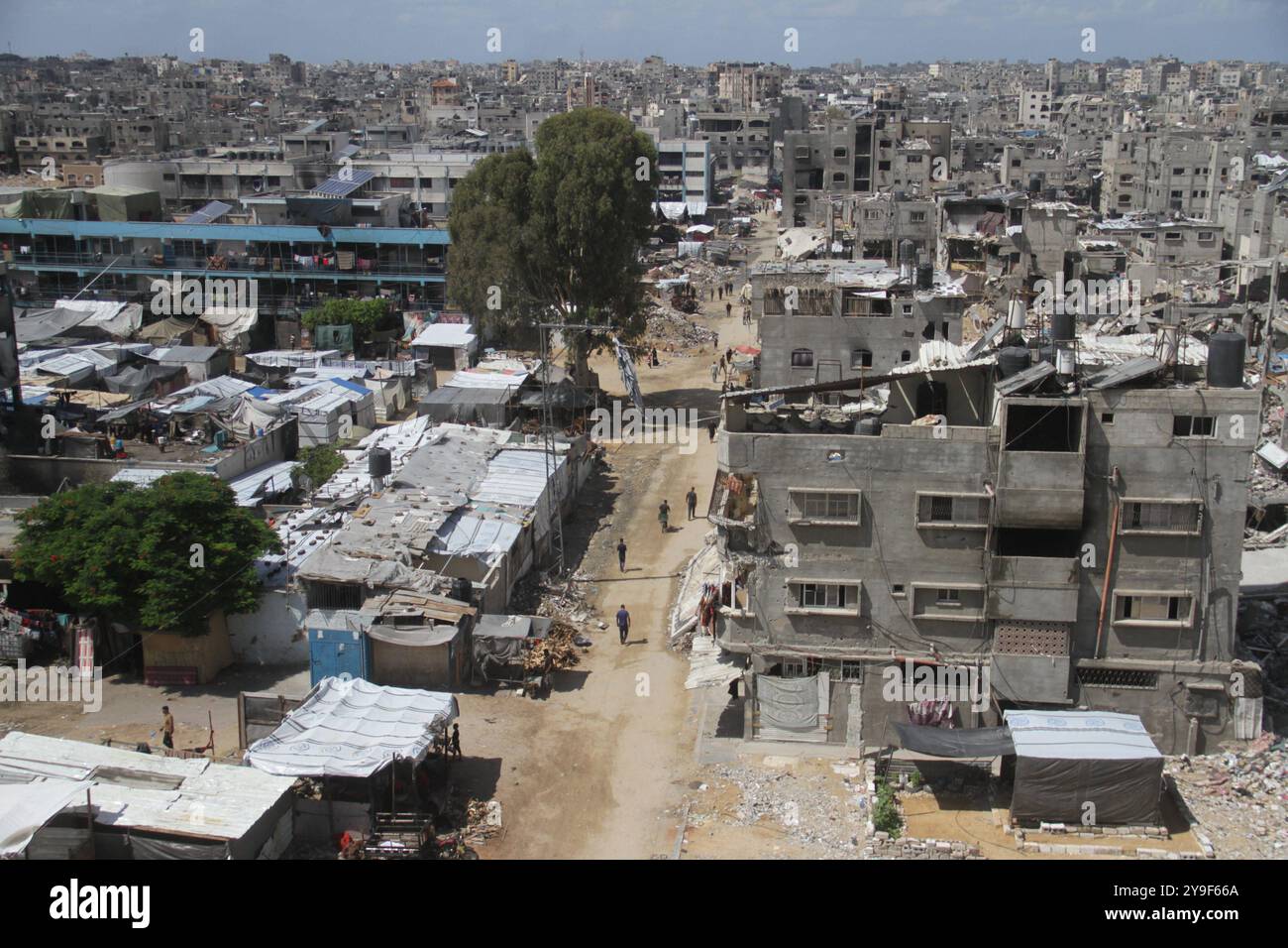 Palestinian-Israel conflict in the Gaza Strip Palestinians line up at a ...