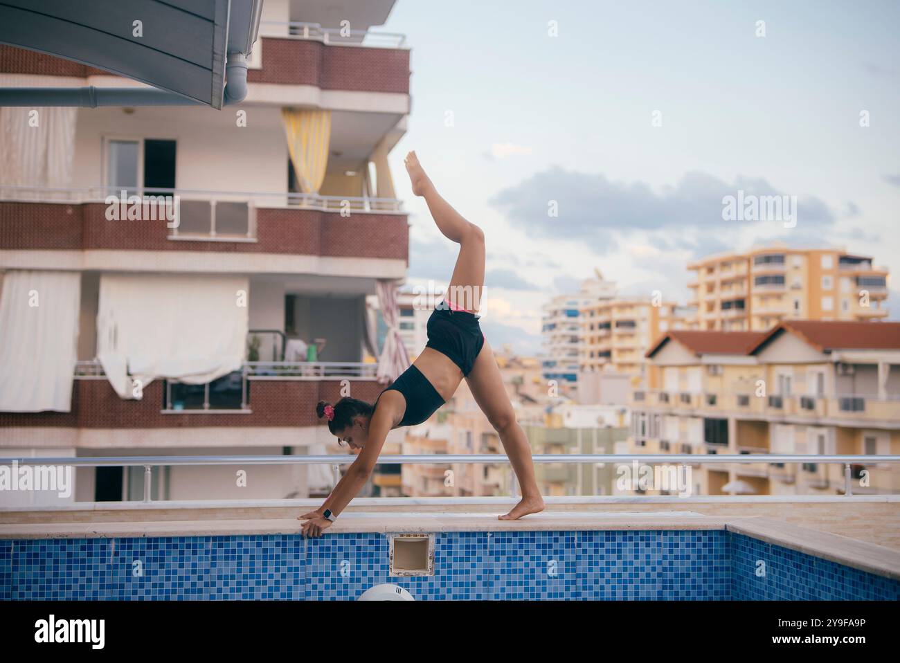 A Dynamic Acrobat Gracefully Performing a Handstand by the Relaxing ...