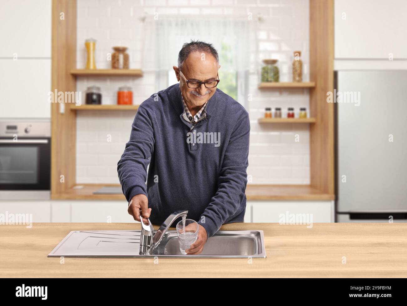 Man drink water tap hi-res stock photography and images - Alamy
